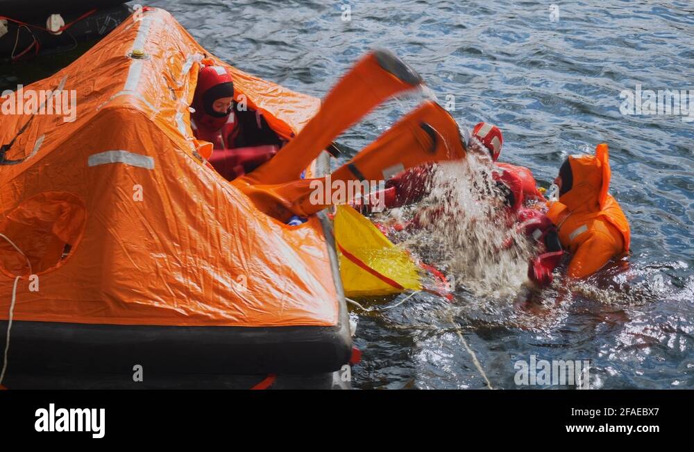 Training exercise with a survival inflation life raft boat with people ...