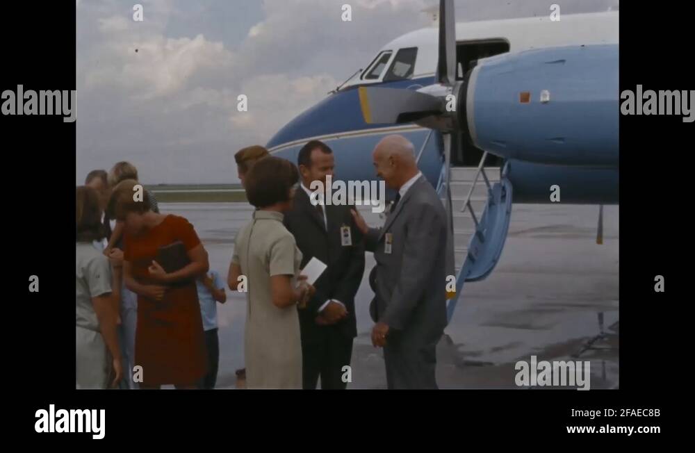 Dr. Gilruth meets astronauts Cooper and Conrad at Ellington Air Force ...