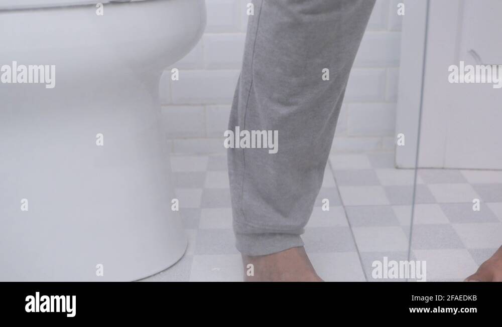 man sit on toilet and drop his pants down and pooping Stock Video ...
