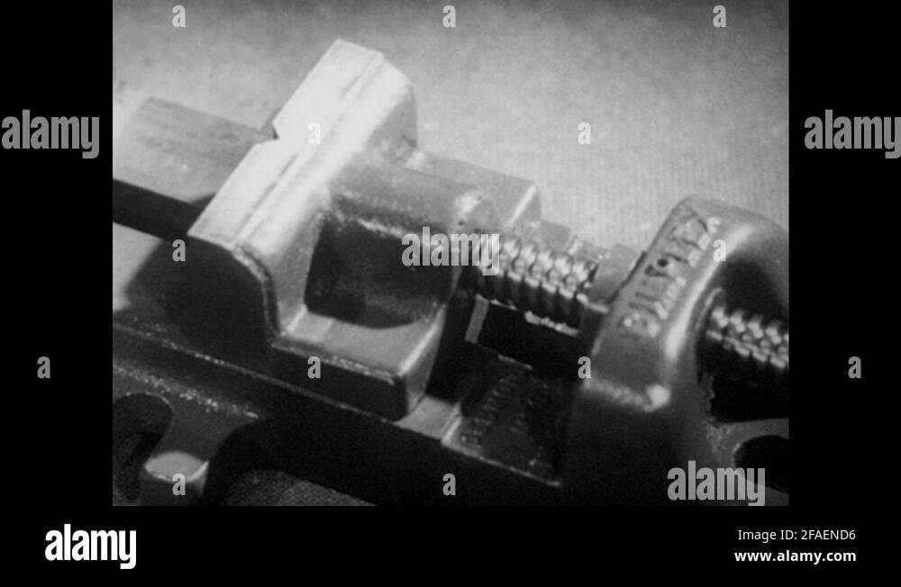 1940s: Vice clamp opens and closes. Person points at various parts of ...