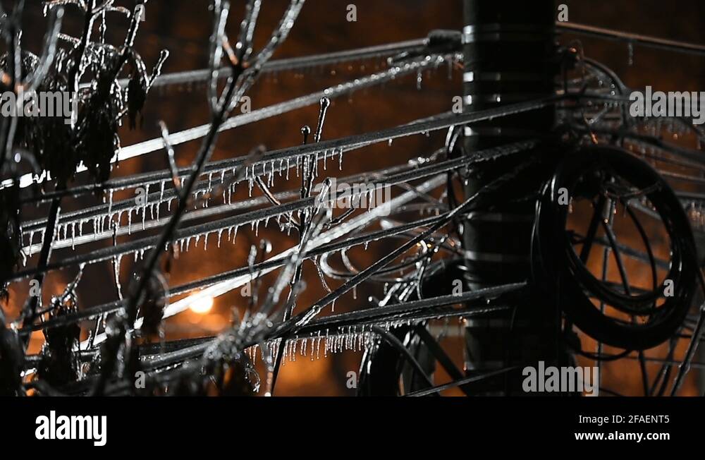 Electricity cables covered in ice after frozen rain phenomenon Stock ...
