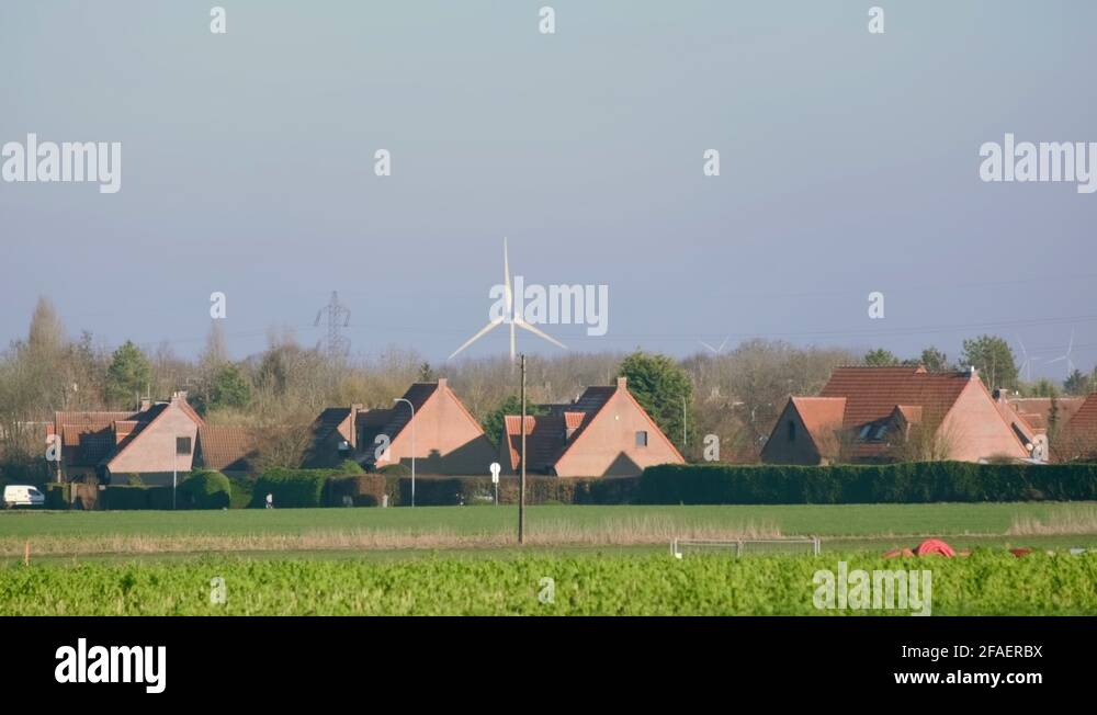 Wind turbine behind houses Stock Videos & Footage - HD and 4K Video ...