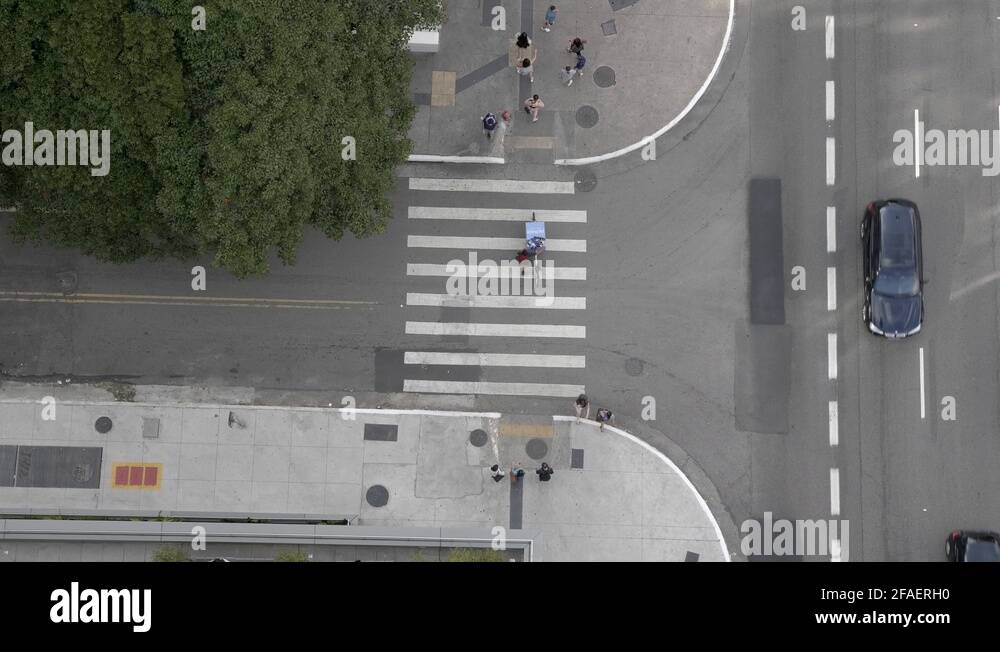Birds eye view of pedestrians crossing, road markings on road surface ...