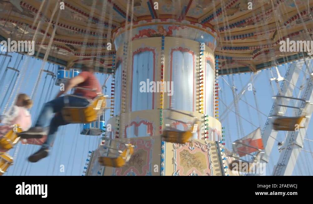 Static shot, of a giant Carousel, thates up and down and in a circle ...