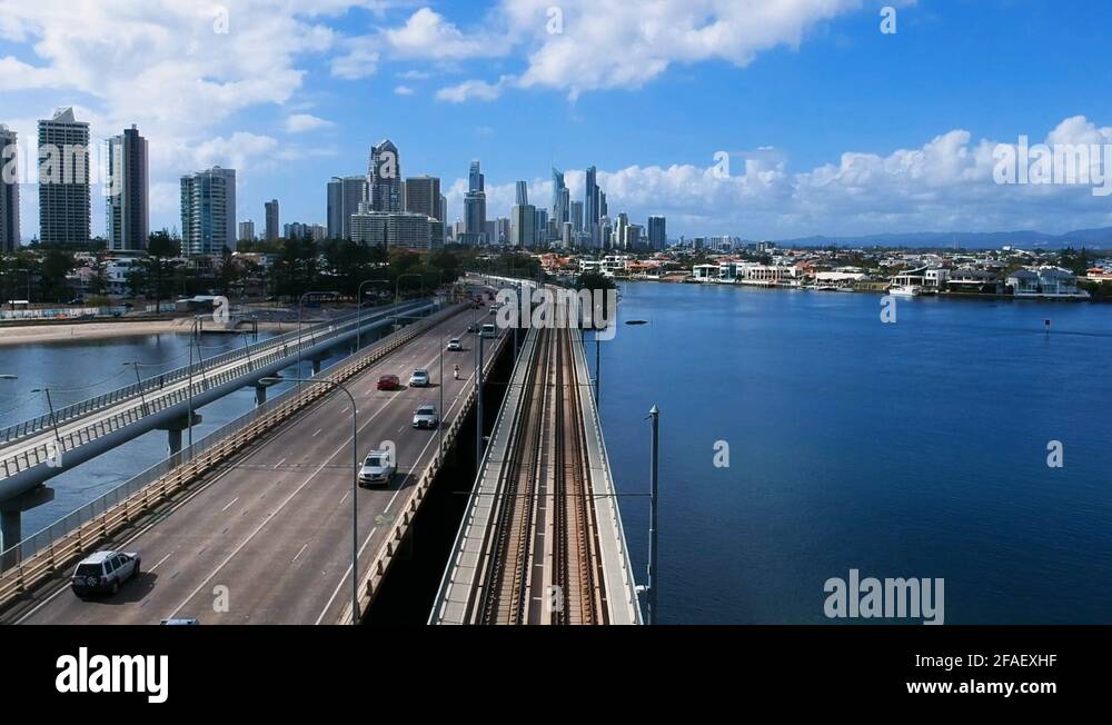 A bridge leading into a city over a large body of water Stock Video ...