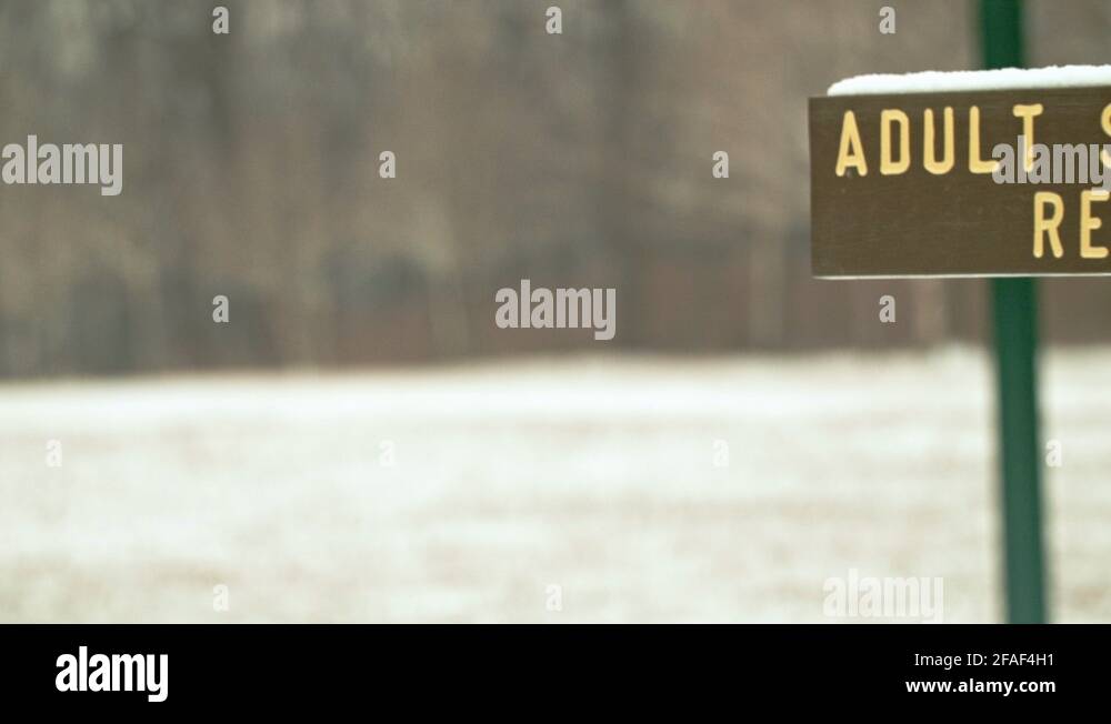 Adult Supervision Required Sign in Snowy Park SLIDE LEFT Stock Video ...