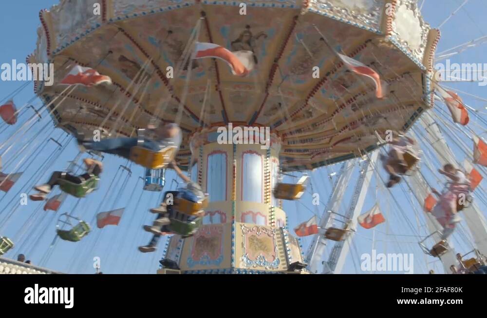 Static shot, of a giant Carousel, thates up and down and in a circle ...