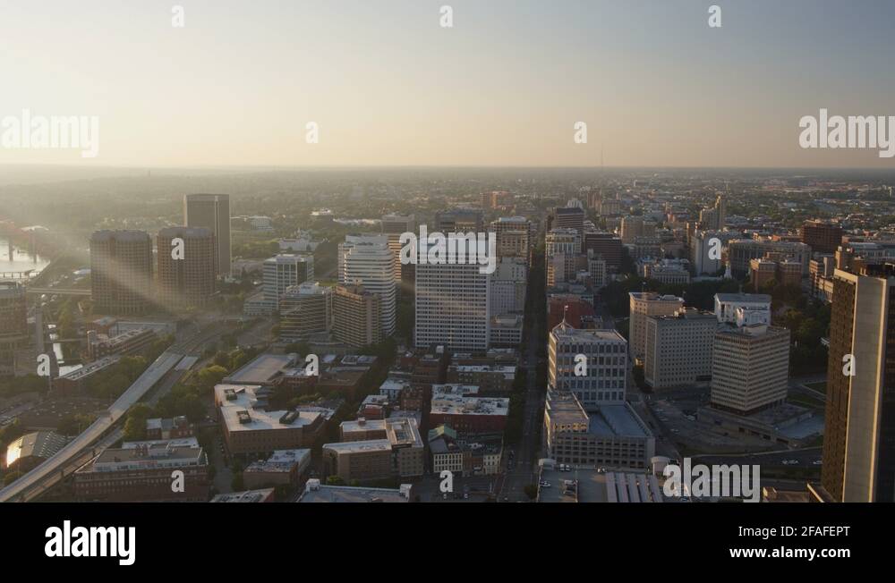 Richmond Virginia Aerial - Reverse panning birdseye of sunset cityscape ...