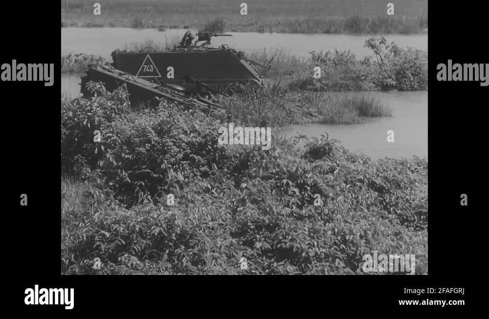 Soldiers patrol area in an amphibious tanks - 1961-1962 Stock Video ...