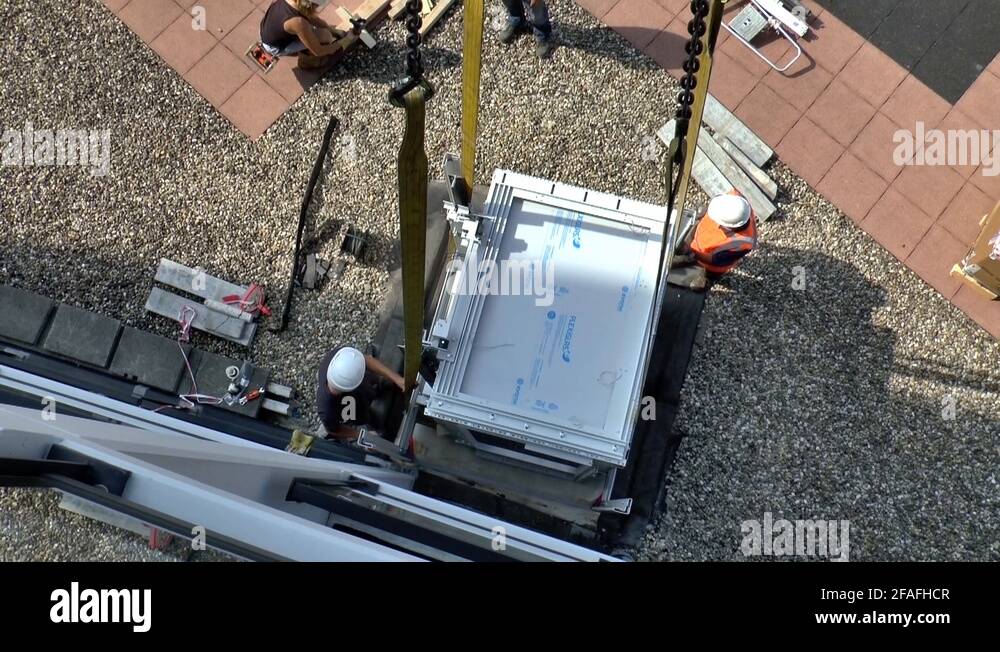 Construction Workers Installing The Lift Cabin On Site Top View Stock ...