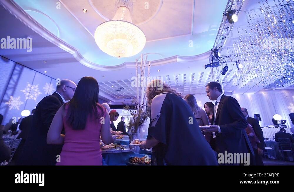 Group of people grabbing food at a buffet in a banquet hall Stock Video ...
