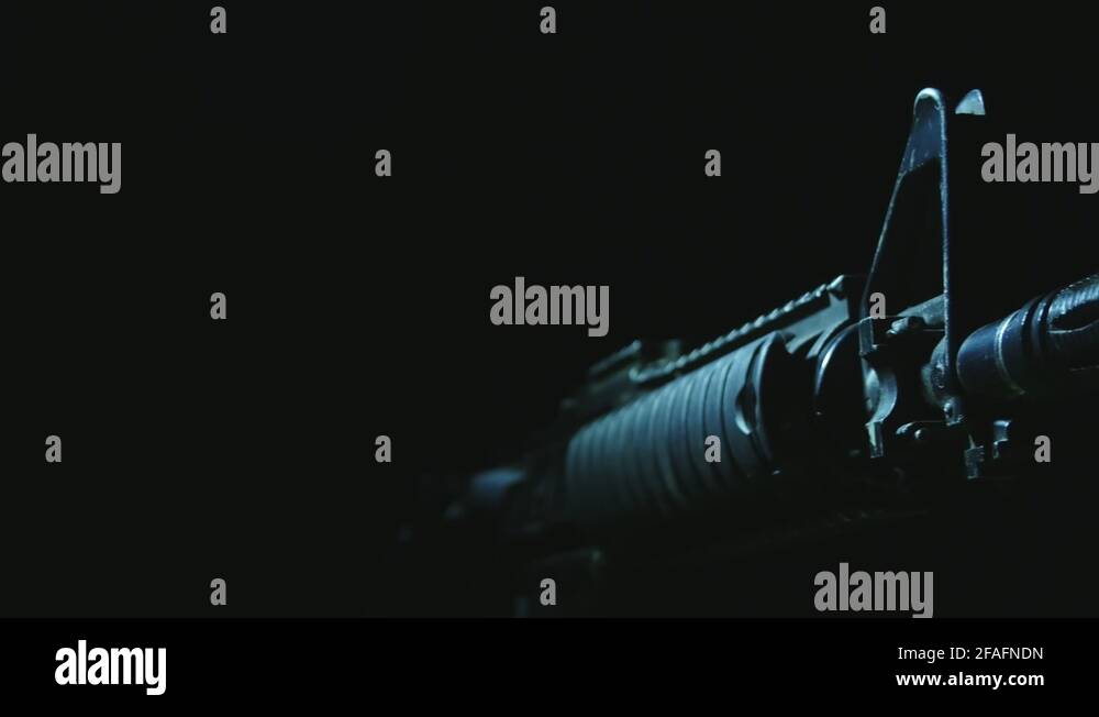 Assault rifle standing on a magazine and handle turning aside in a ...