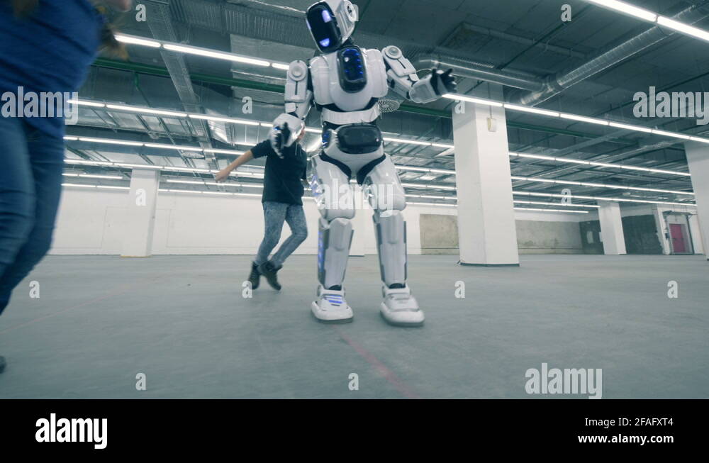 Cyborg trying to catch children, close up. Futuristic humanoid robot ...