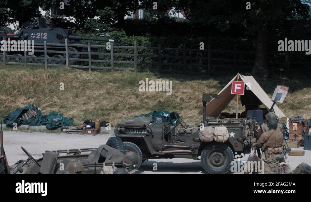 World war two re-enactment battle. American GI army soldiers firing ...
