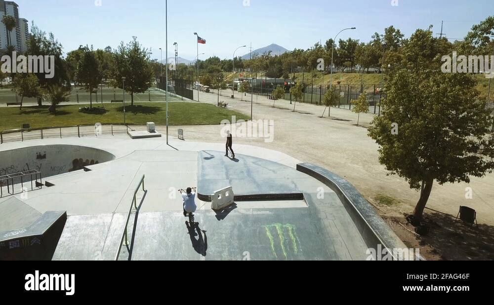 BMX RIDER BIKER DOING TRICKS AND FLIPS IN SKATE PARK AERIAL SHOT 4K ...