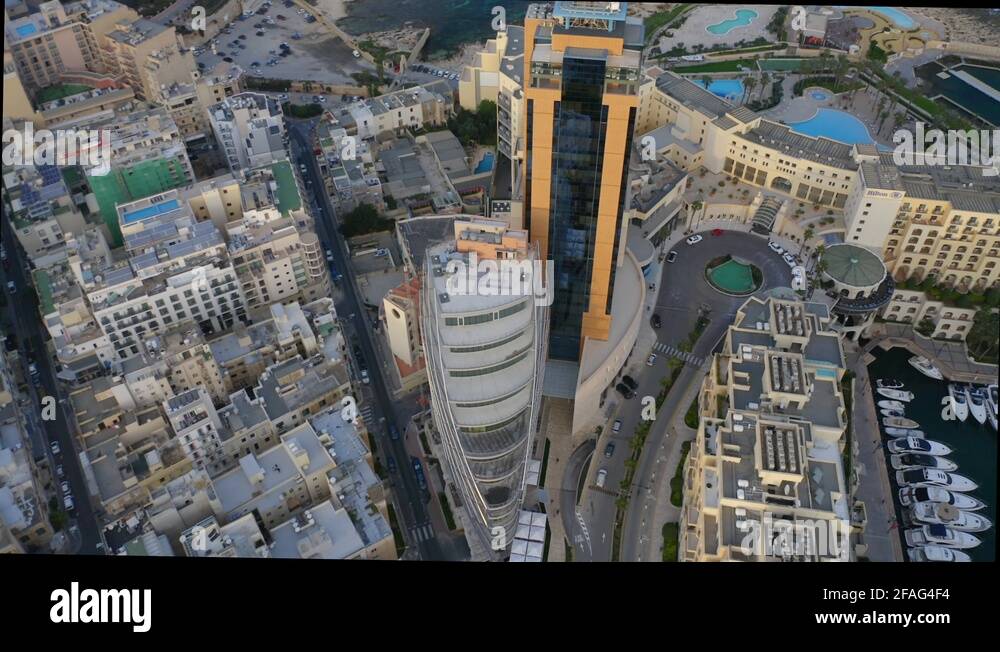Video shows Malta with tall modern hotel building and surrounded low ...