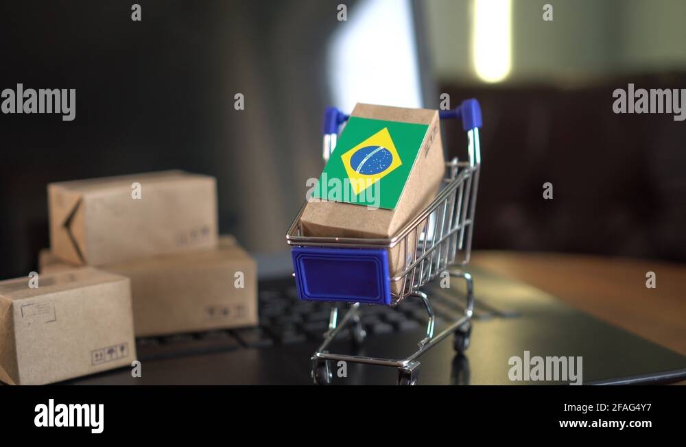 Parcel packaging box with a flag of Brazil in a shopping cart Stock ...