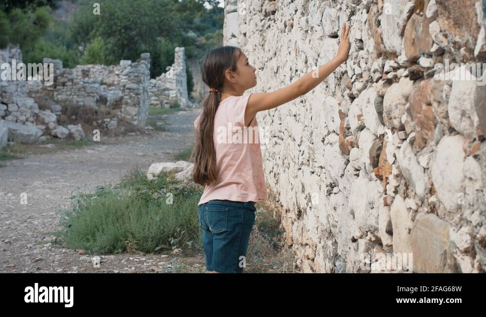 Girl touching wall Stock Videos & Footage - HD and 4K Video Clips - Alamy
