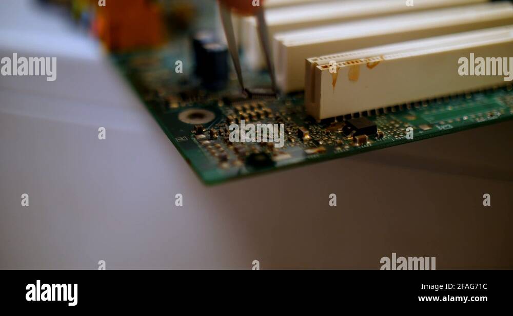 smoking soldering iron on a computer motherboard closeup Stock Video ...
