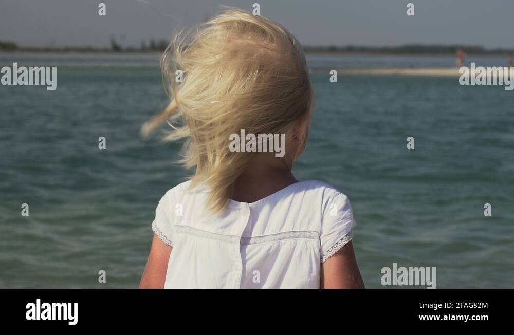 Crying little girl by the sea. Little girl with tears in her eyes Stock ...