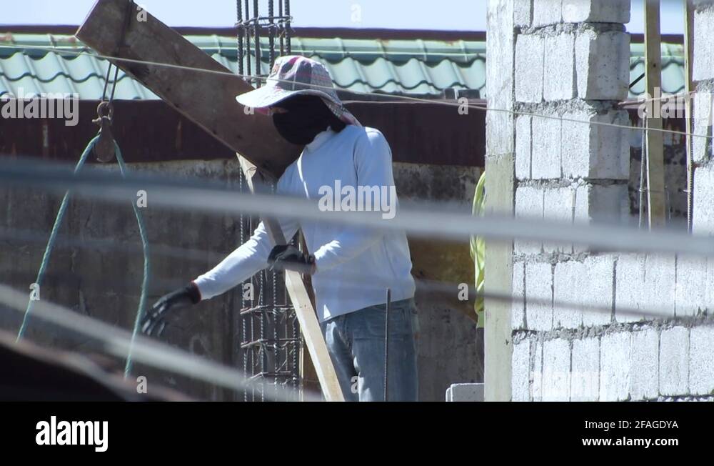 Unsafe Workers Building A House in Poor Area of the Philippines Stock ...