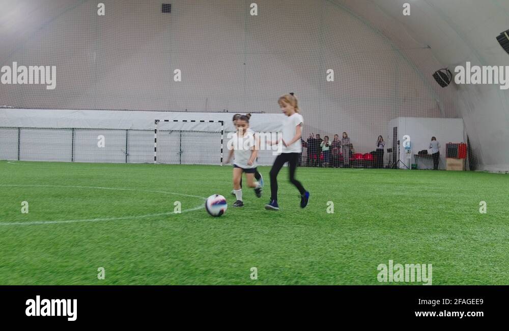 Indoor football arena. Little kids playing football Stock Video Footage ...
