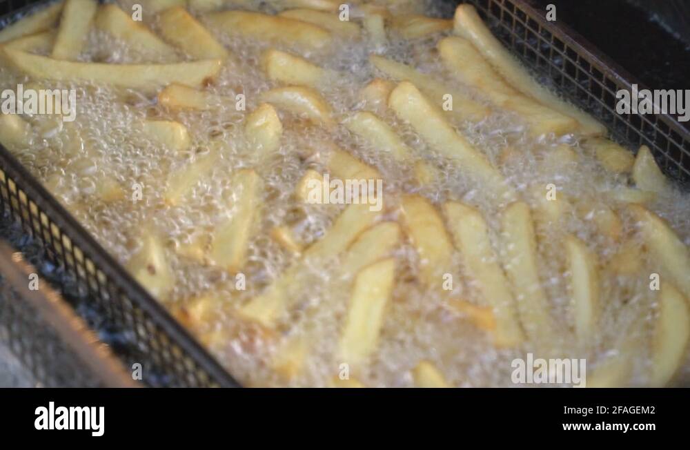 Process of cooking french fries in the deep fryer Stock Video Footage ...