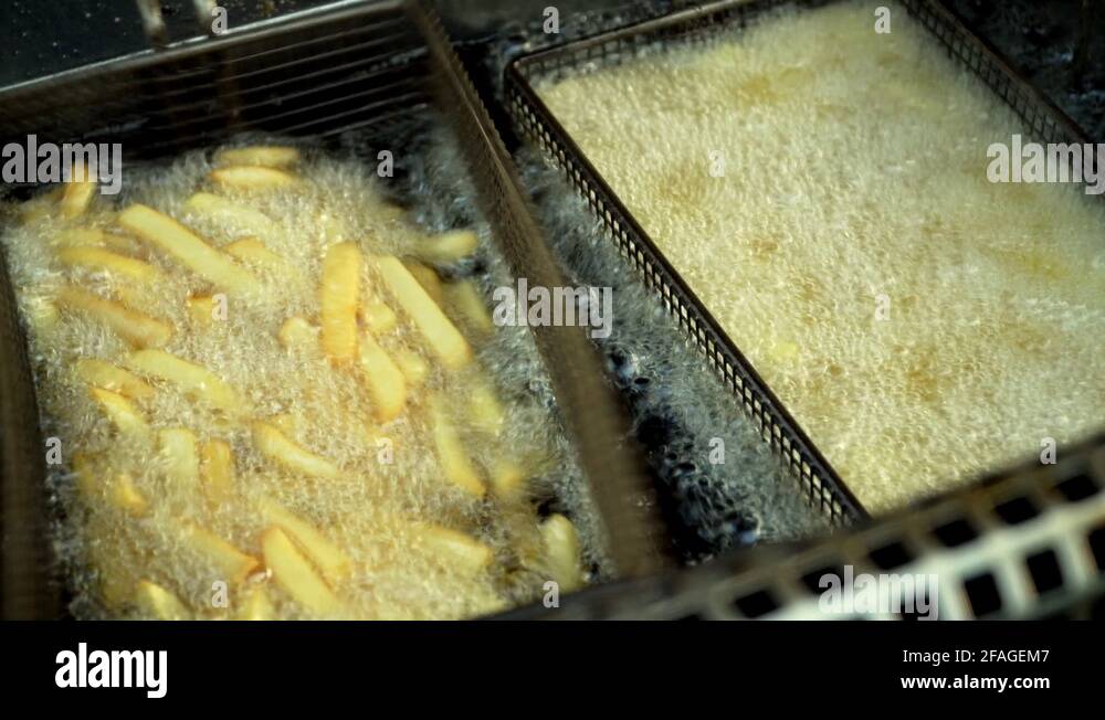 Process of cooking french fries in the deep fryer Stock Video Footage ...