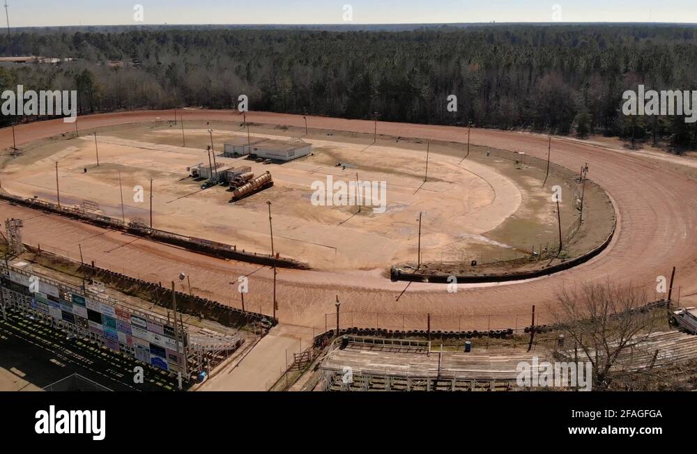 Slow pan out from Sumter Speedway With a vulture flying into scene at ...