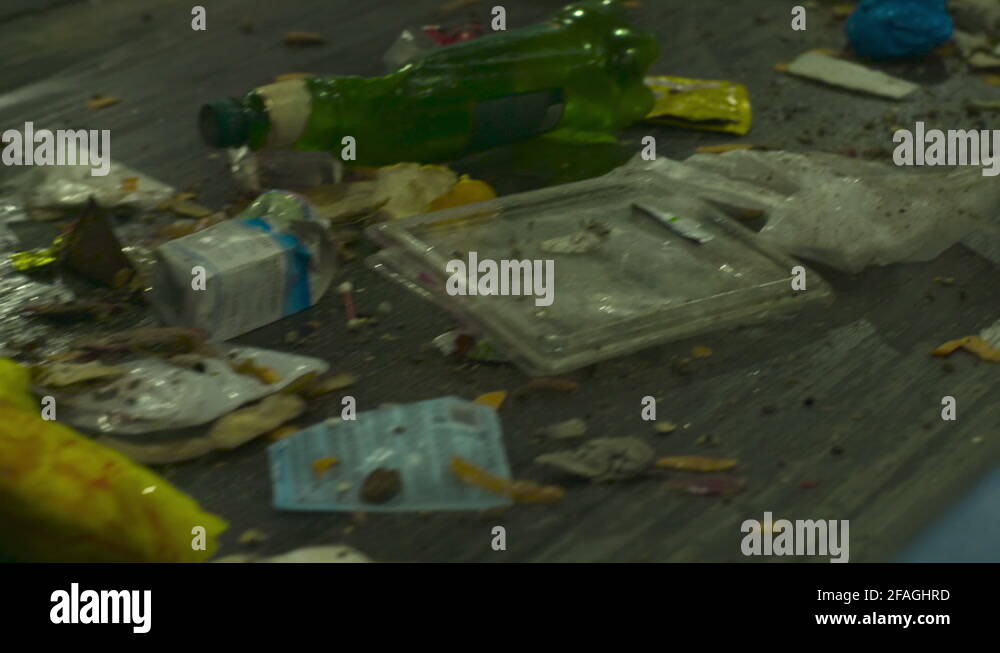 Garbage on the conveyor of the waste processing plant. Recycling plant ...