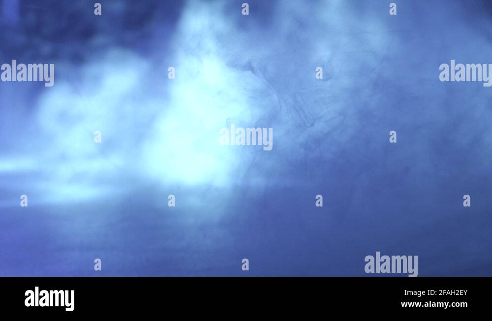 Stage smoke, spreading blue smoke in space, work process smoke machine ...