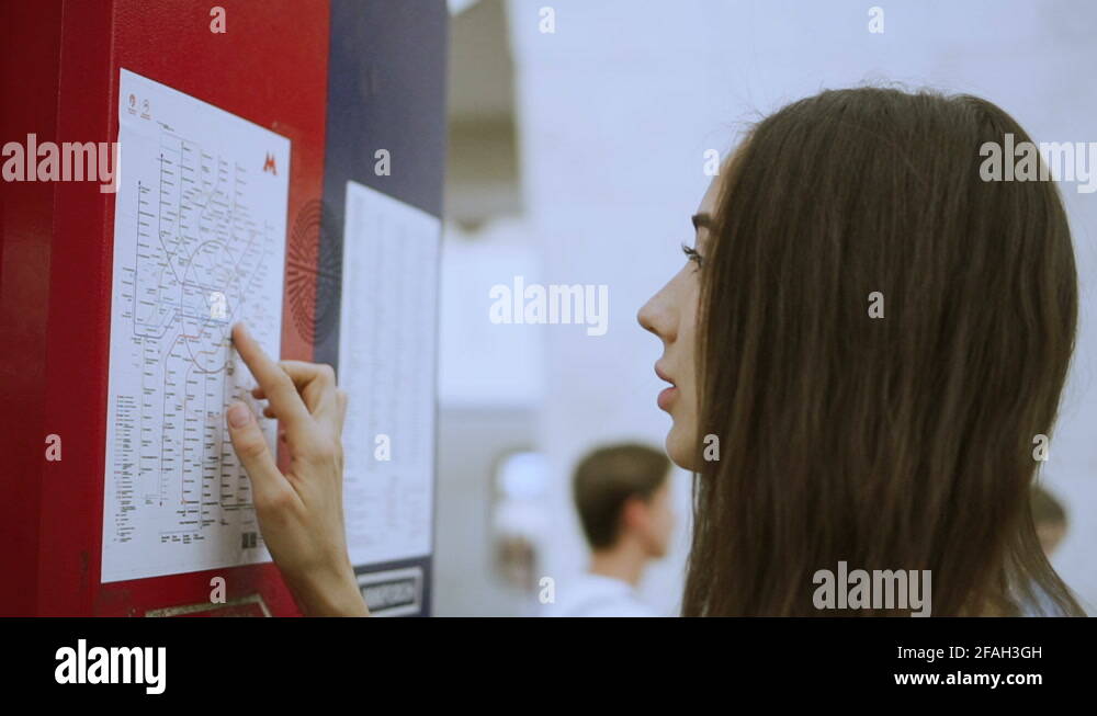 Woman beautiful closeup look map of line subway train metro. People to ...