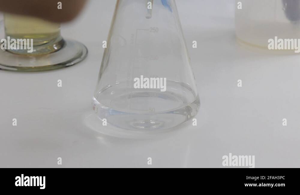 Chemical reaction in a flask in a chemical laboratory Stock Video ...