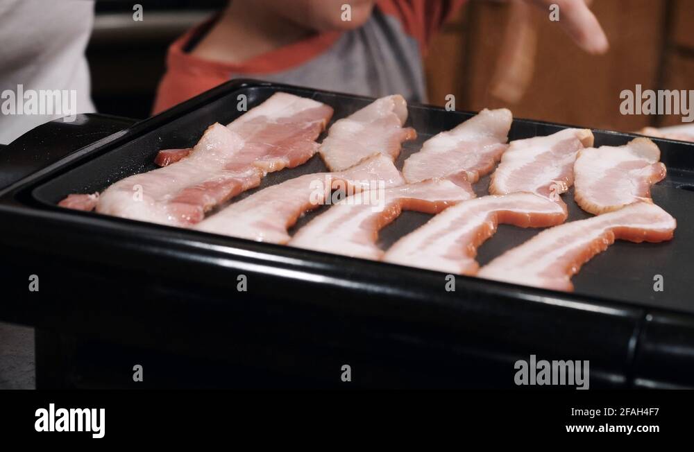 Raw bacon slices Stock Videos & Footage - HD and 4K Video Clips - Alamy