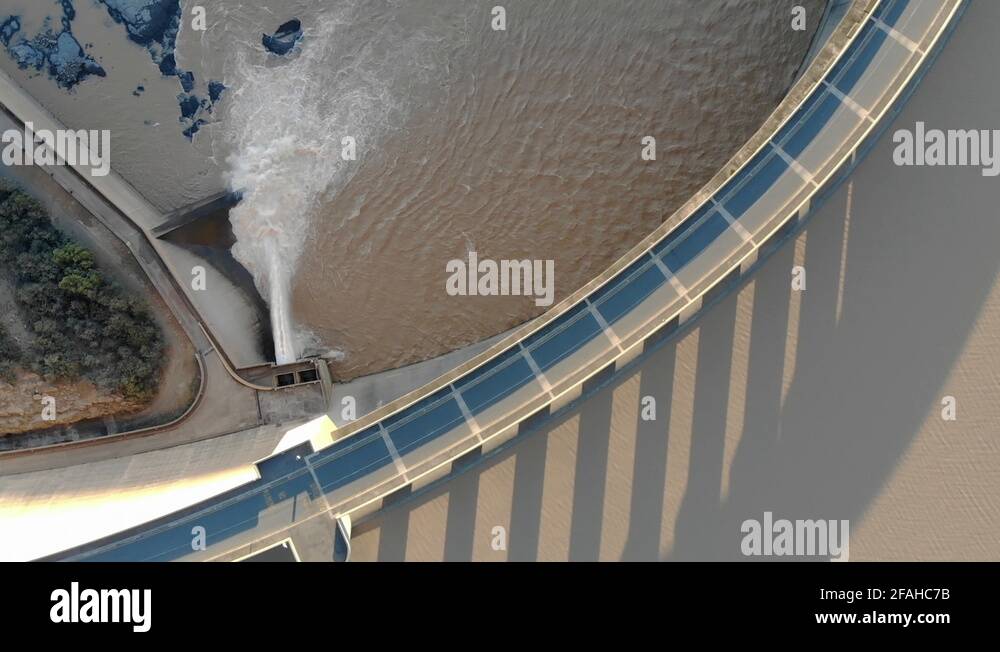 Top down video of dam wall with water outlet Stock Video Footage - Alamy
