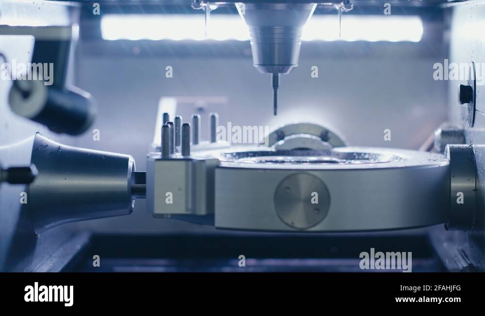 Dental milling machine carving out shape of human teeth from metal ...