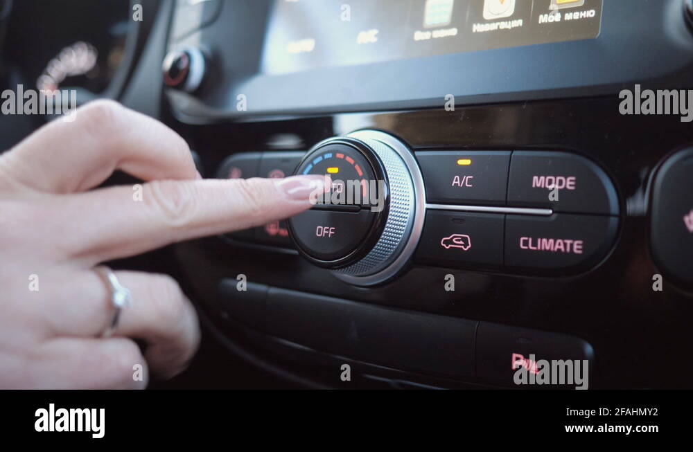 Woman Driving car and pushing buttons on radio, dashboard and wheel ...
