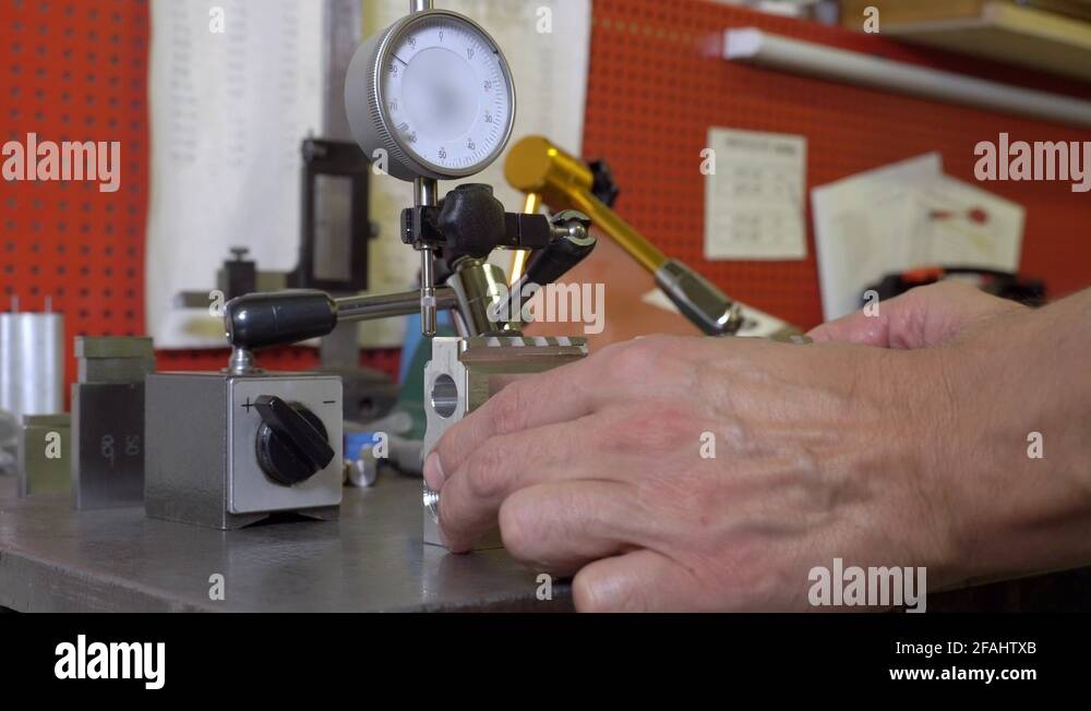 engineer checks quality of parts for weapons on measuring device Stock ...