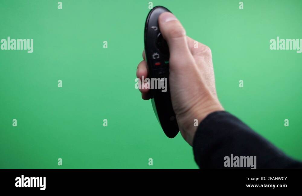 Television Remote Changing Channels On Green Screen. Hand using a ...