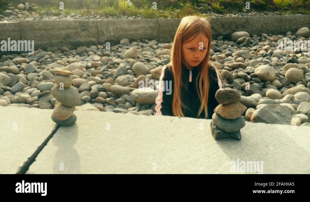 Child stacking stones Stock Videos & Footage - HD and 4K Video Clips ...