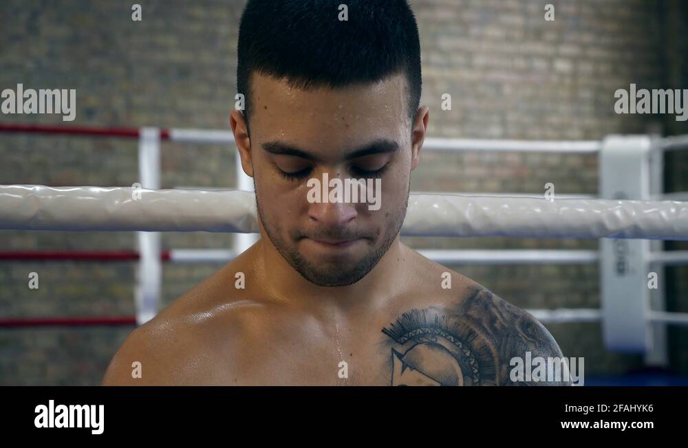 Close-up Muscular Professional Male Boxer Resting on Boxing Ring After ...