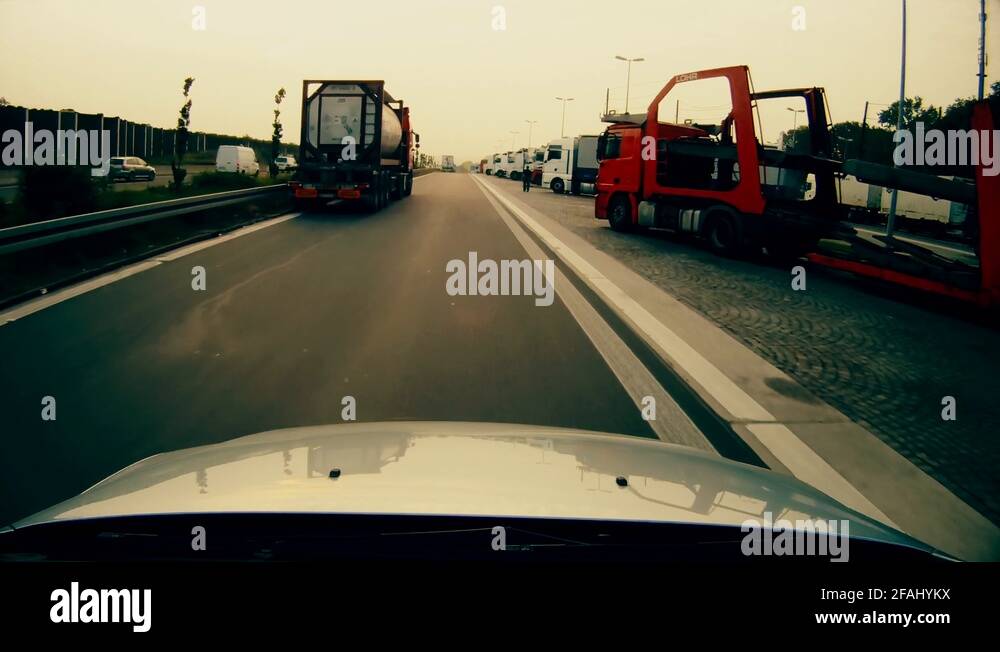 A highly stylized clip of a car speeding down the highway on the German ...