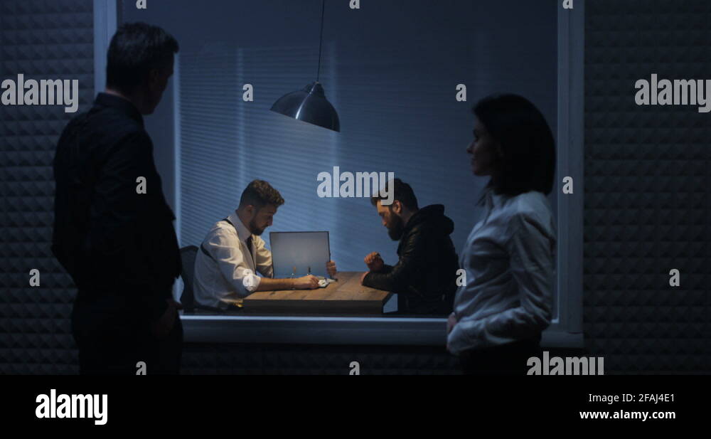 Investigators watching an interrogation Stock Video Footage - Alamy