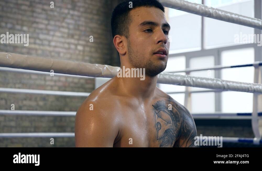 Close-up Muscular Professional Male Boxer Resting on Boxing Ring After ...