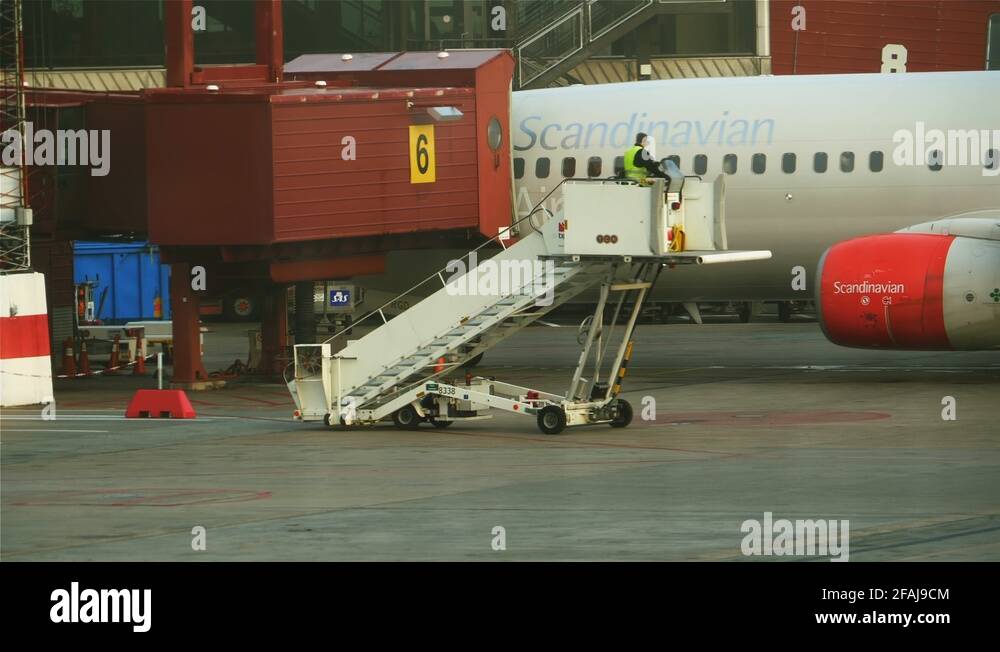 An airplane stair trucking towards the gate, clearing the airplane for ...
