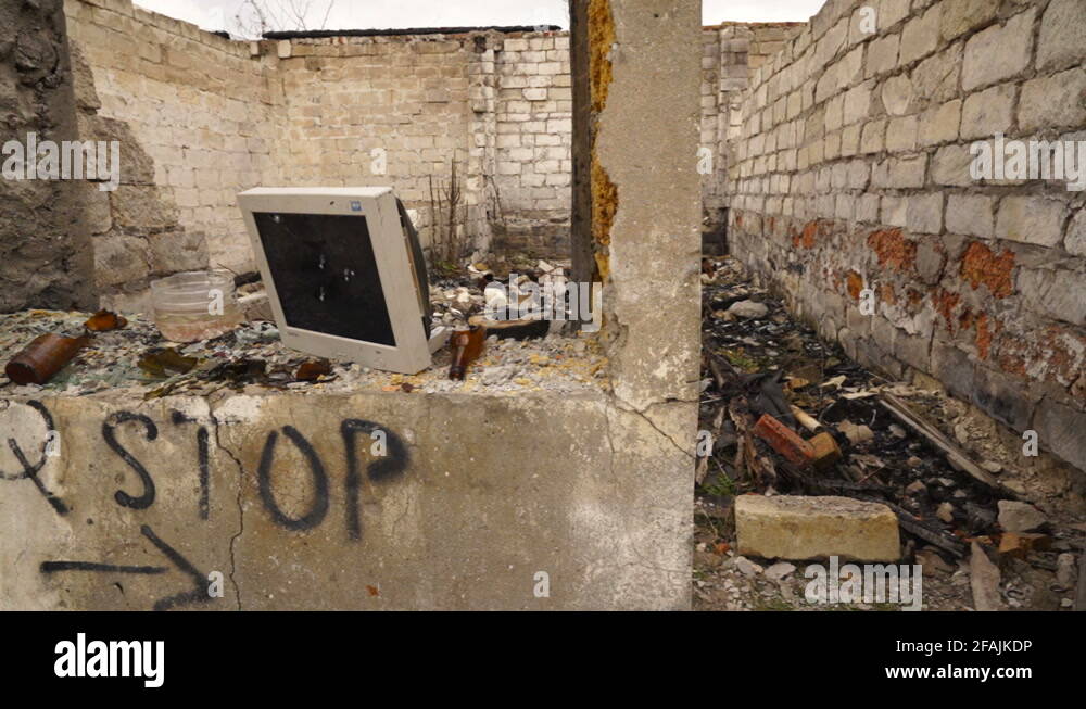 Smashed old computer monitor on ruined building wall Stock Video ...