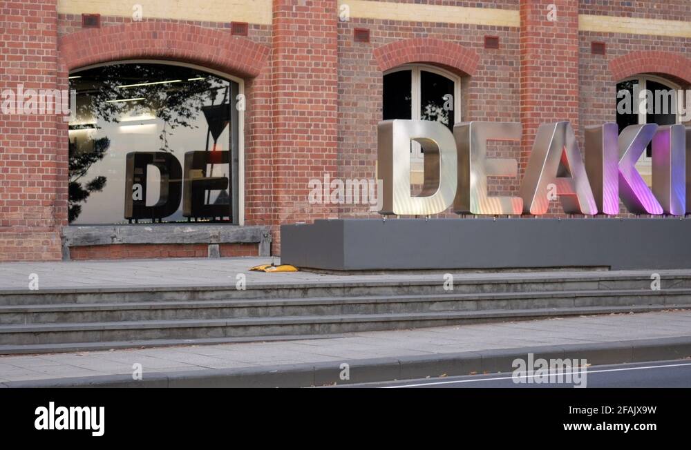 Deakin sign. Waterfront campus Geelong. PAN RIGHT Stock Video Footage ...