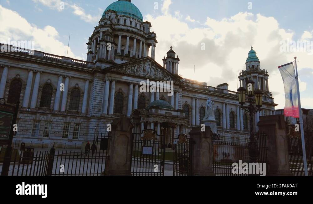 Belfast city hall almost silhouette with blue sky and white fluffy ...
