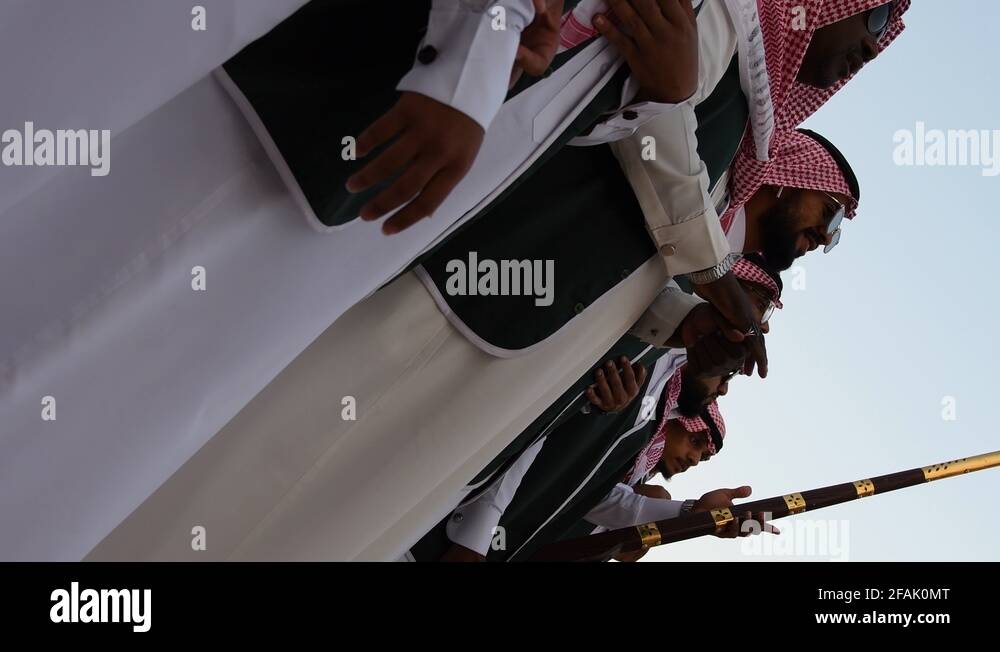People from Saudi Arabia are dancing traditional dance called Ardah ...