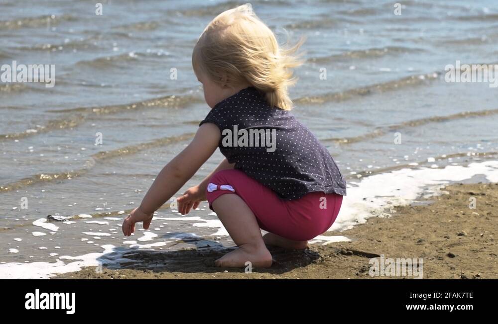 Ecstatic child by the lake. Little girl on nature. Unity with nature ...
